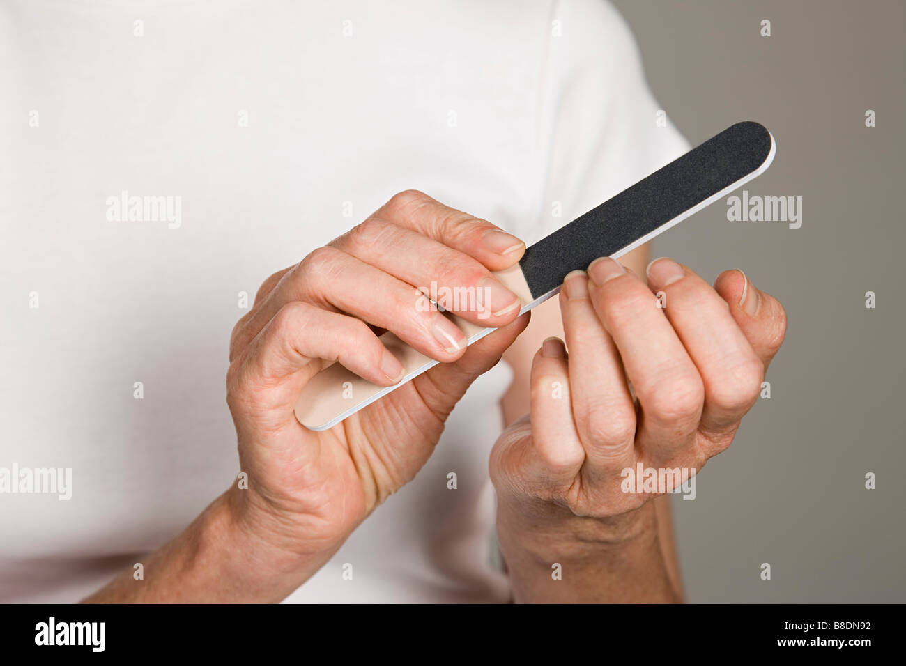 Woman file nail 60 hi-res stock photography and images - Alamy