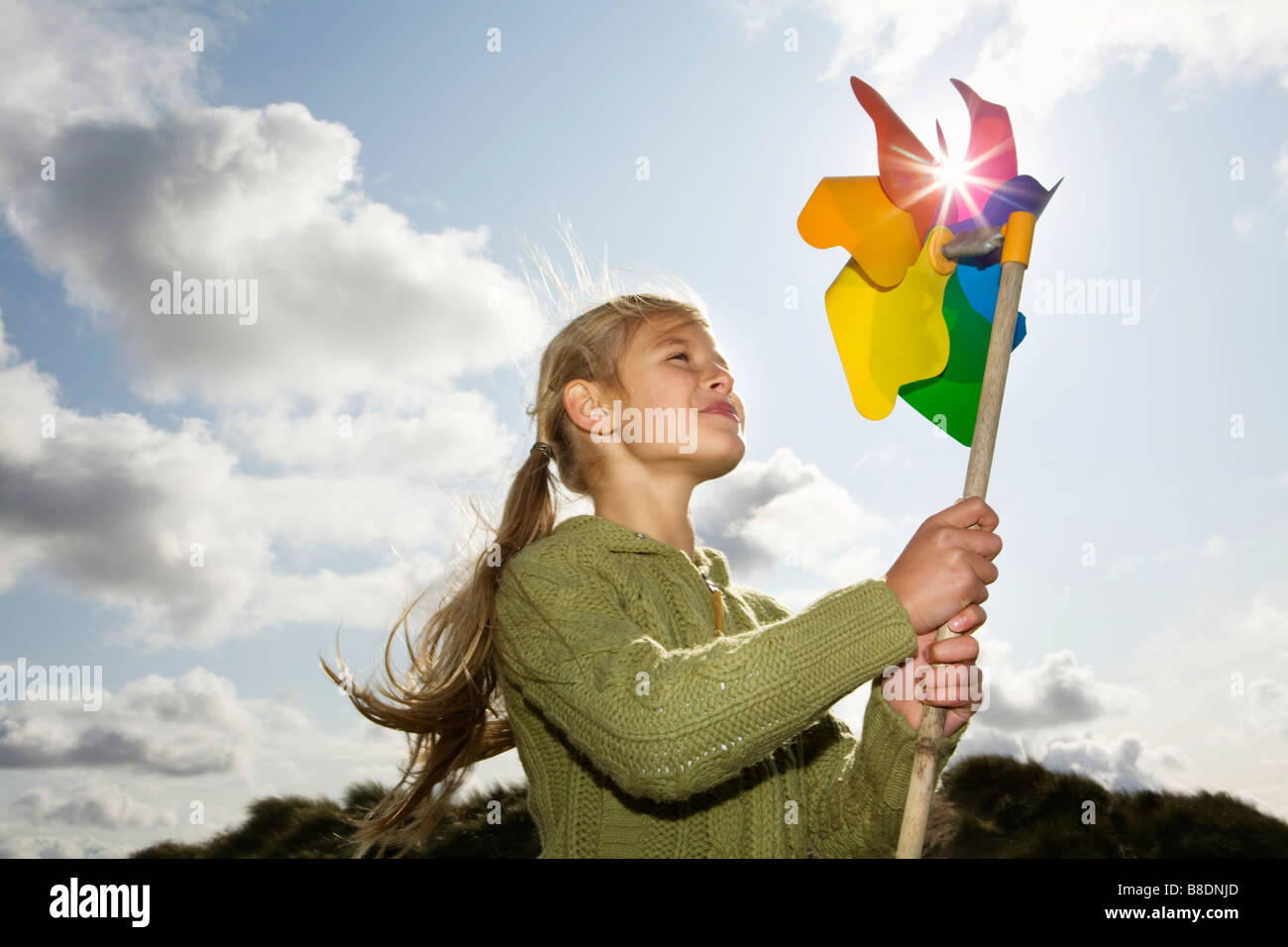 Girl with a pinwheel hi-res stock photography and images - Alamy