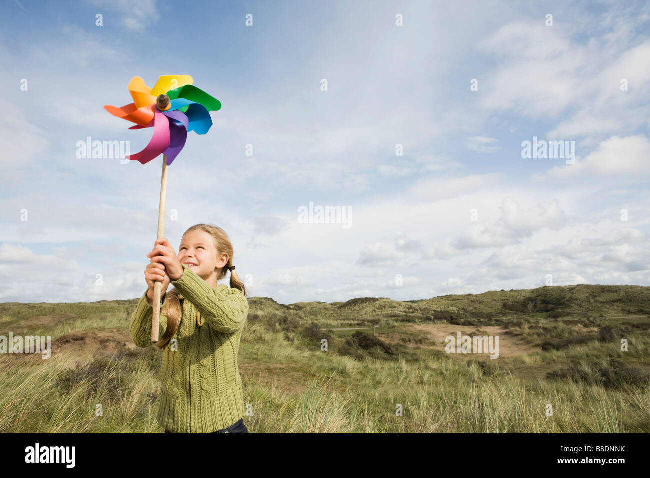 Girl with a pinwheel Stock Photo - Alamy