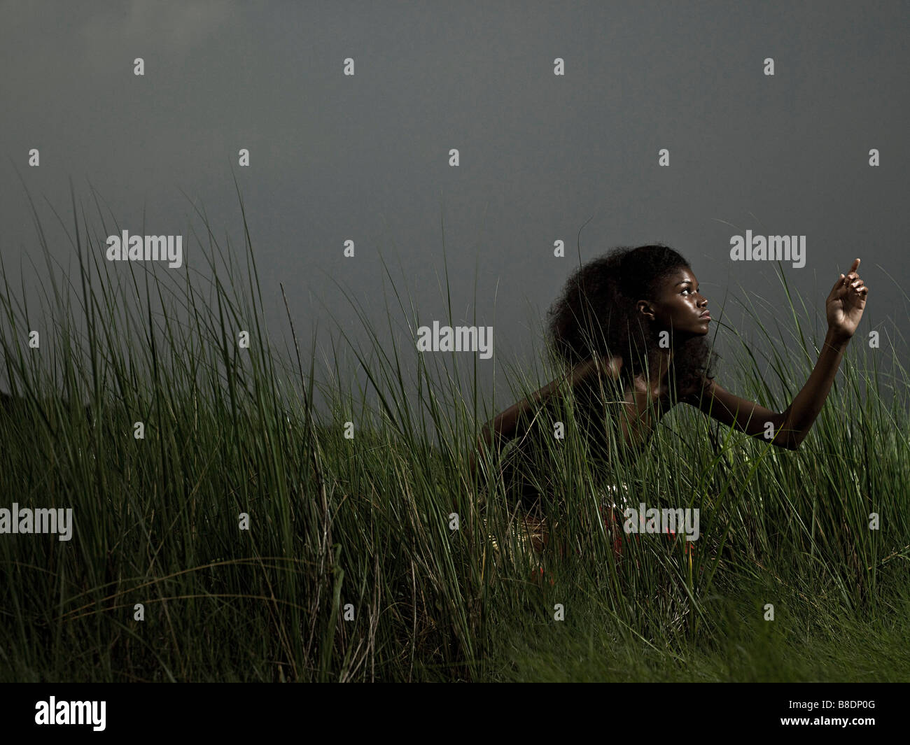 Female athlete in grass Stock Photo - Alamy