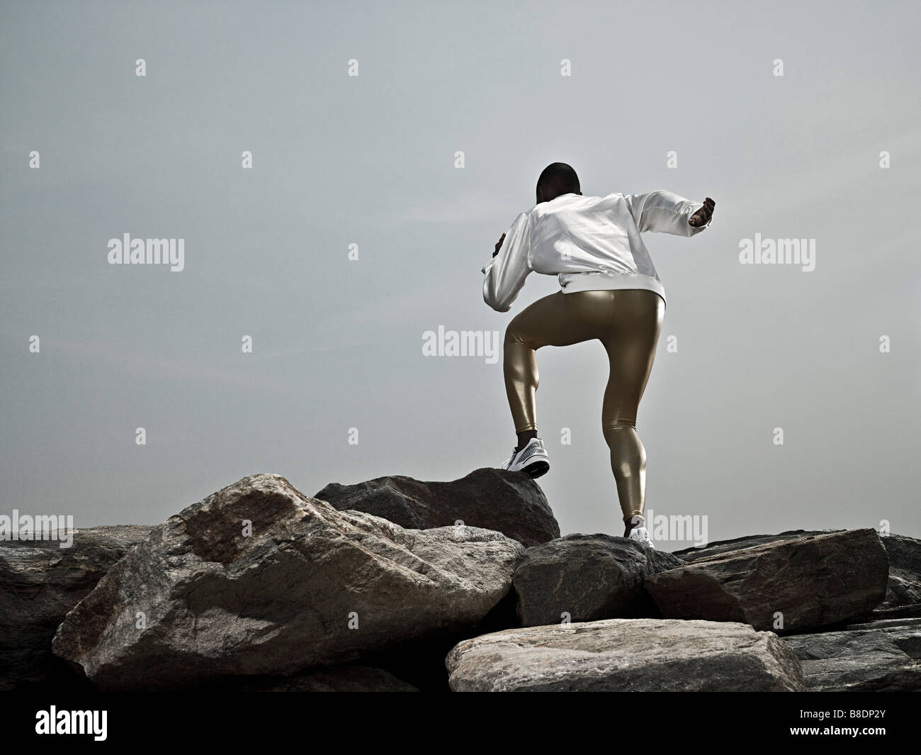 Male athlete on rocks Stock Photo - Alamy