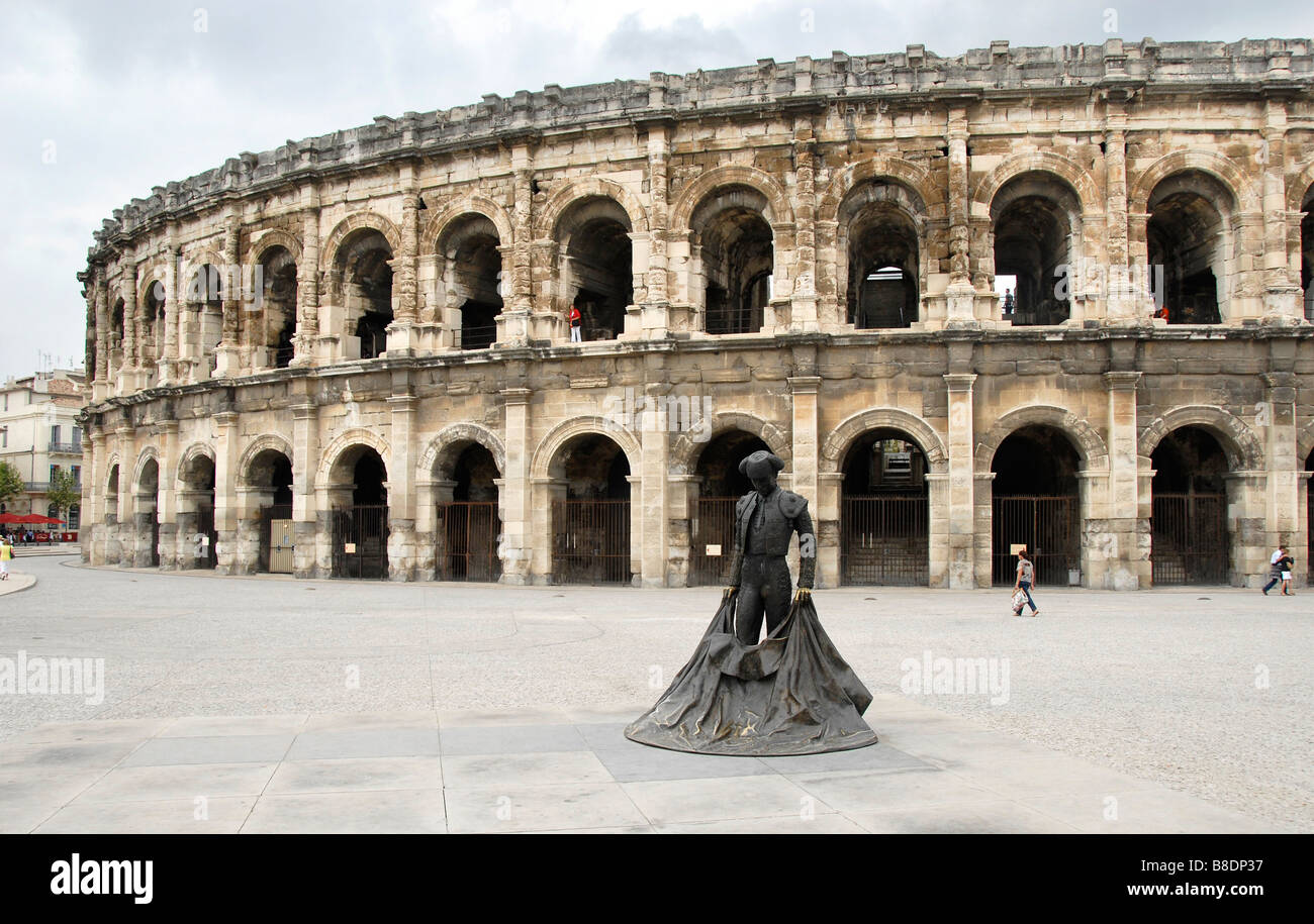 Roman amphitheatre, bullfighter statue, Nimes, France, Europe Stock ...
