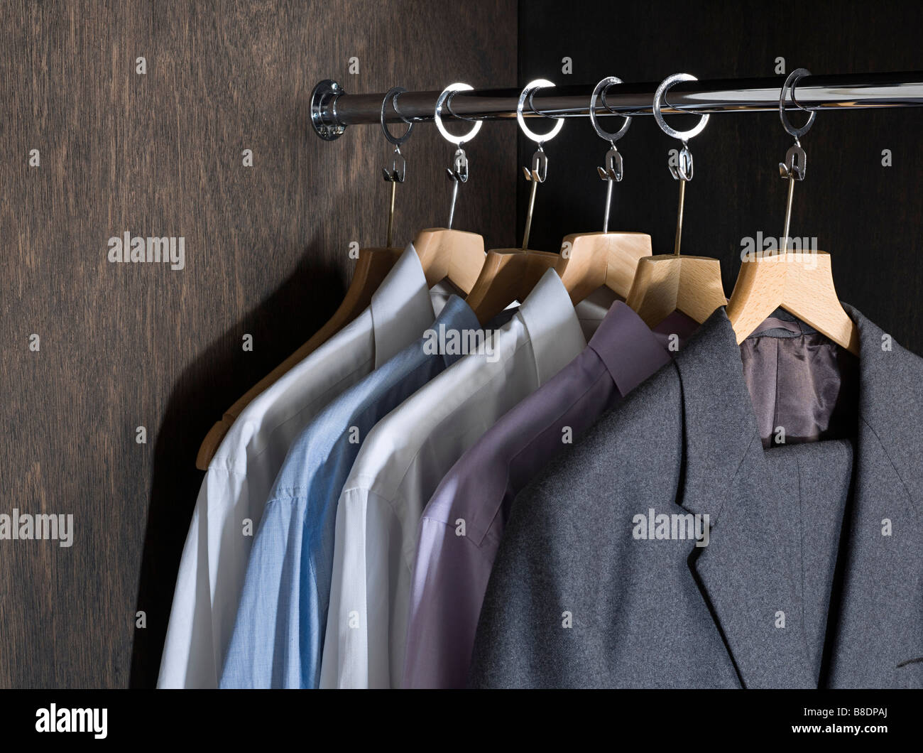 Shirts and suits in a closet Stock Photo - Alamy
