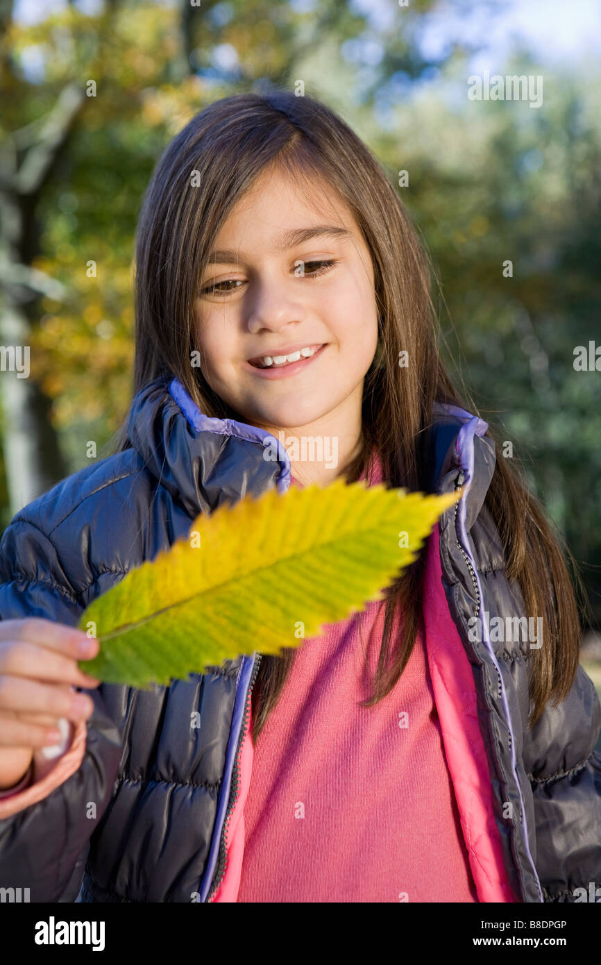 Girl with a leaf Stock Photo - Alamy