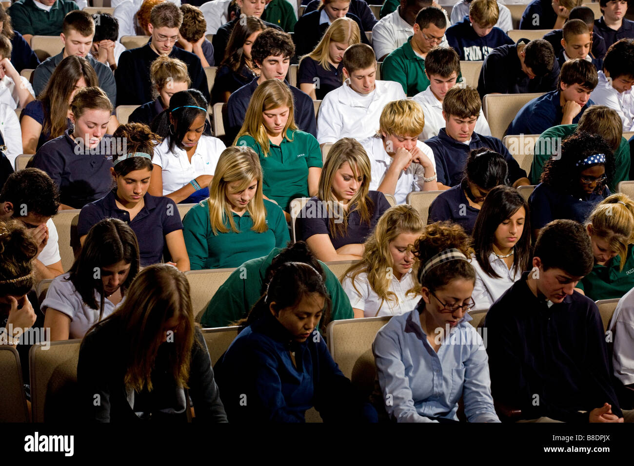 High school and middle school students seated in an auditorium Stock ...