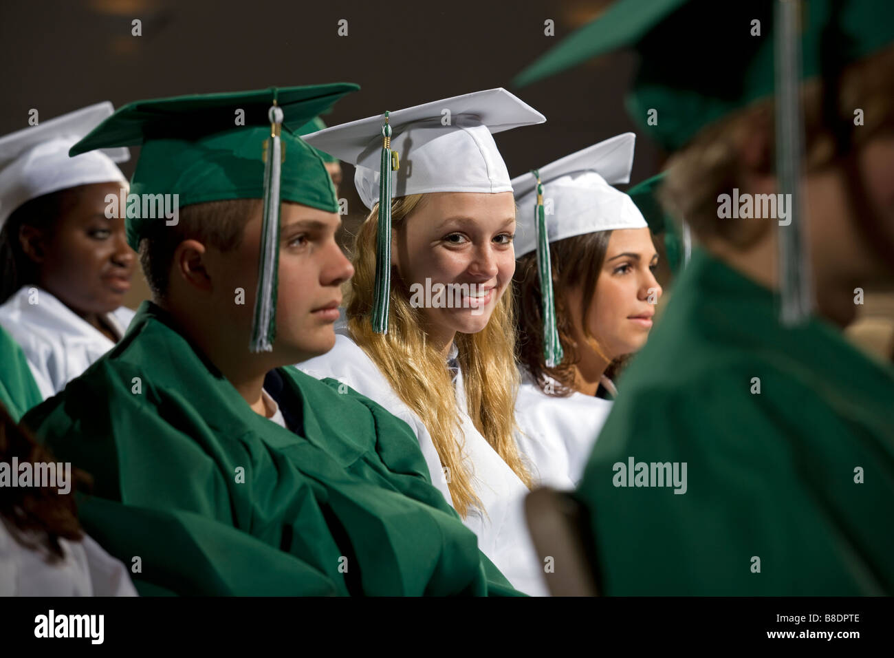 High school students in graduation gowns at commencement ceremony Stock ...