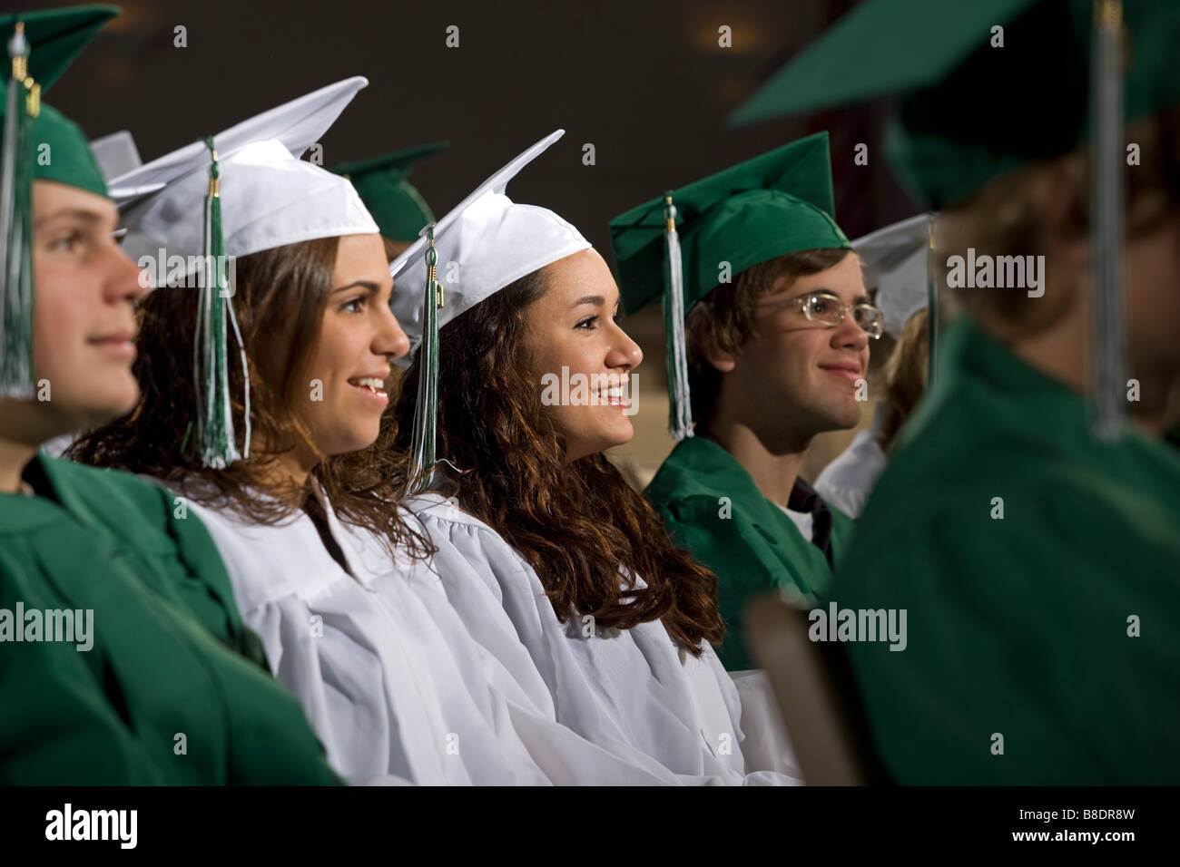 High school students in graduation gowns at commencement ceremony Stock ...