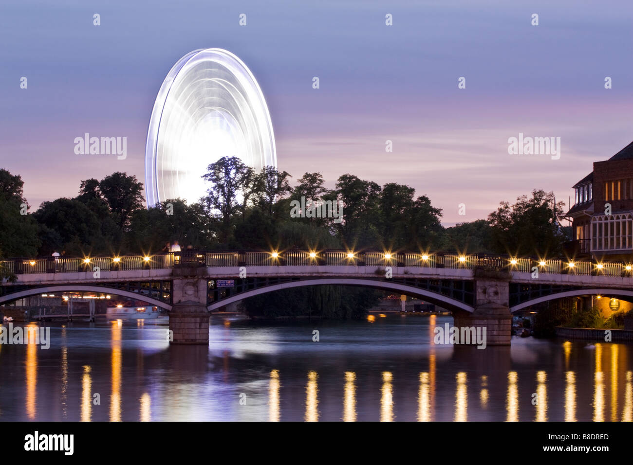 Royal Windsor Wheel and Windsor Bridge at night, with light reflections ...