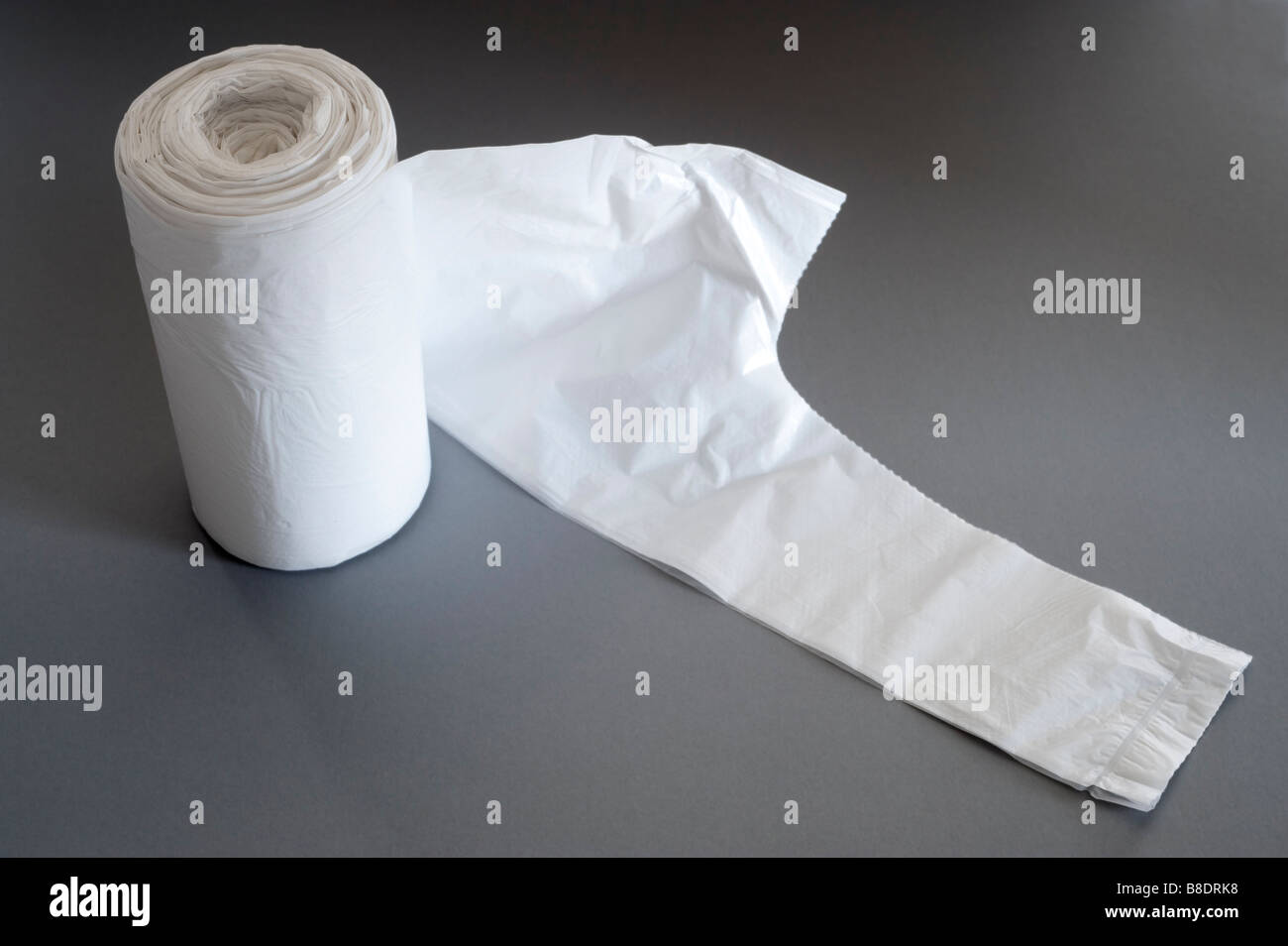 Roll of white plastic refuse bags Stock Photo - Alamy