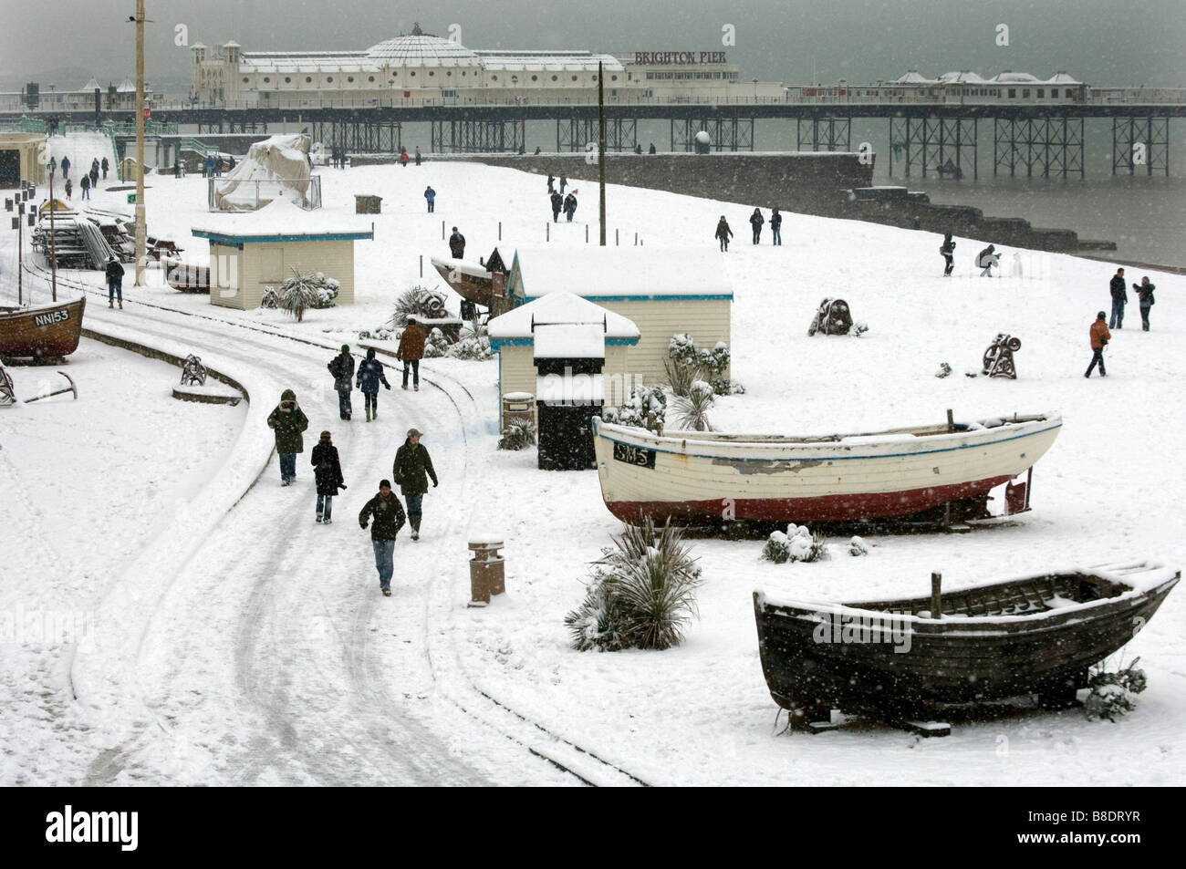 Snow covers Brighton beach with Brighton Palace Pier in the background ...