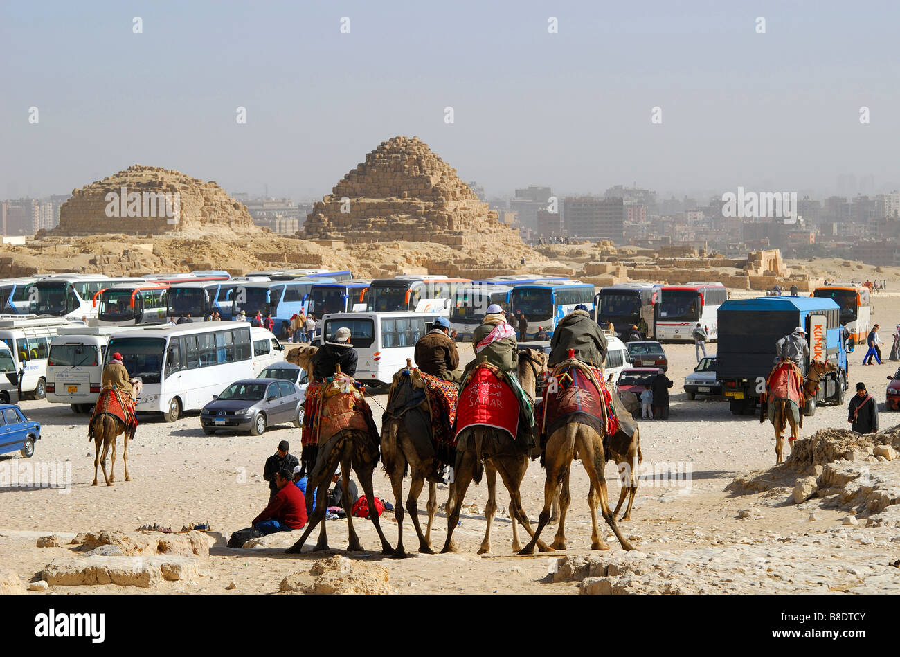CAIRO, EGYPT. Grim reality of the Pyramids at Giza, with tour coaches ...