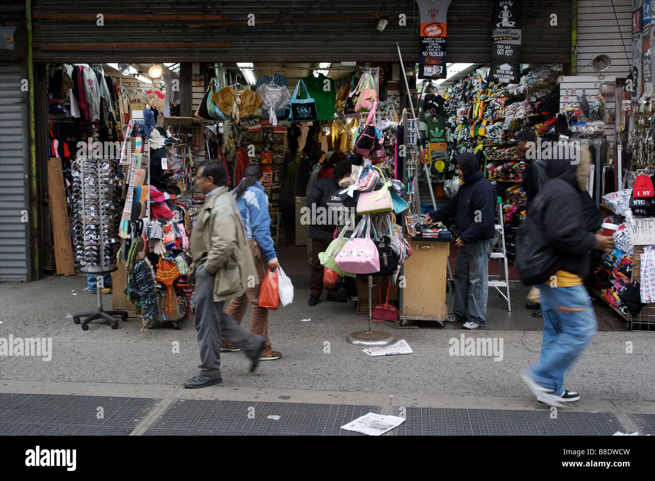 people walking in front of shop on street in new york city Stock Photo ...