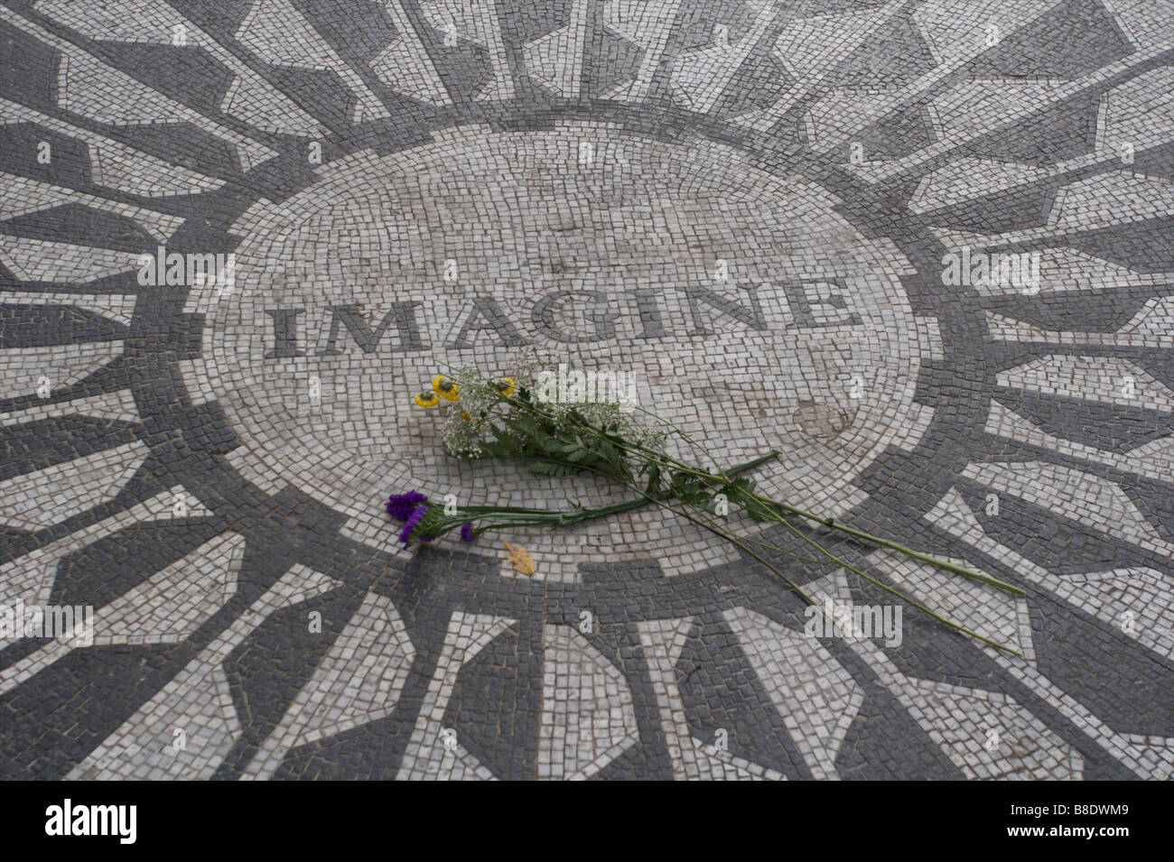 strawberry fields memorial to john lennon in central park with flowers ...