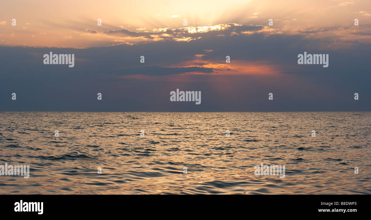 Beautiful sunset over sea surface. Four shots composite picture Stock ...