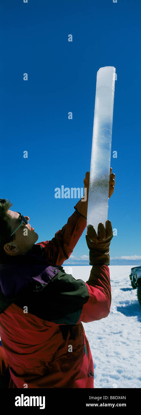 Scientist holding up ice core sample from Langjokull Ice Cap, Iceland ...