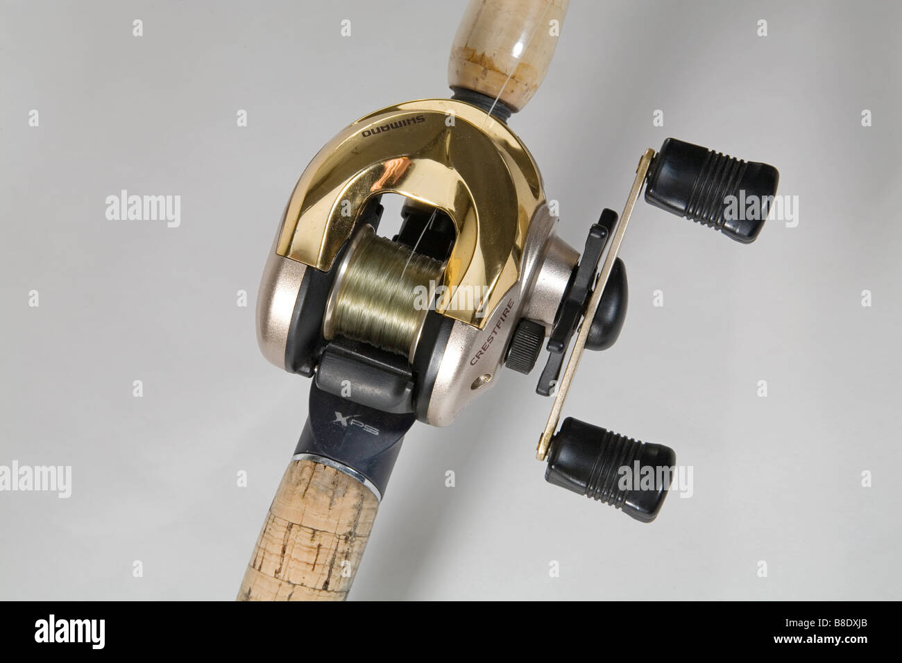 A level wind bait casting reel with monofilament line and seven foot ...