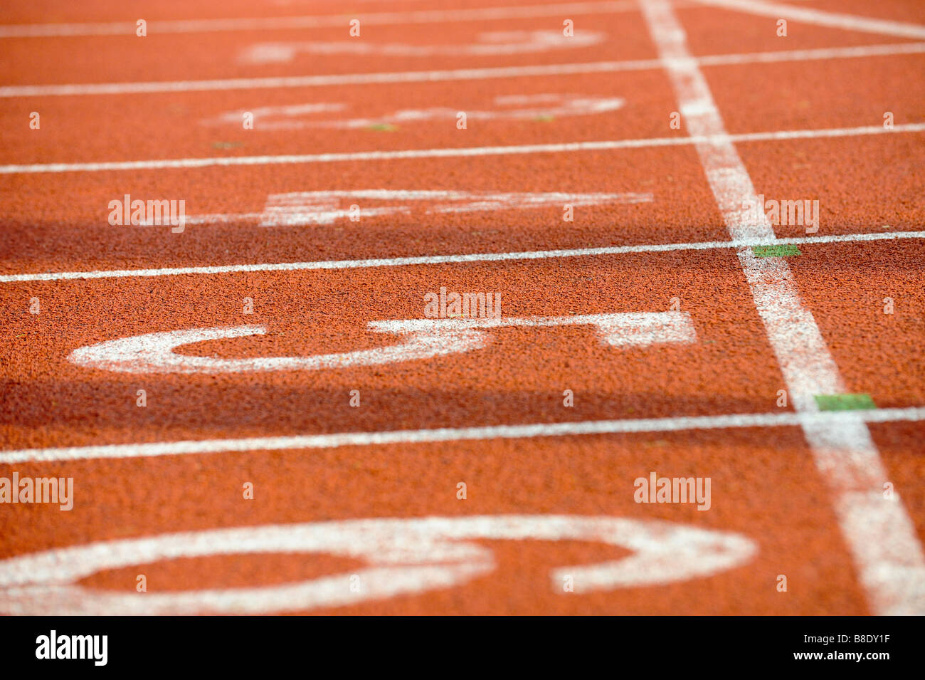 Numbered lanes on Athletics track Stock Photo - Alamy