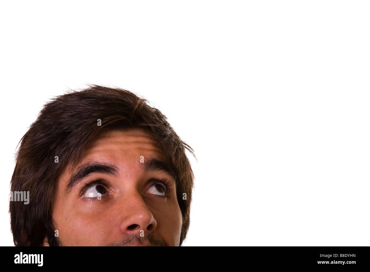 young man face looking to the copy space isolated in white Stock Photo ...