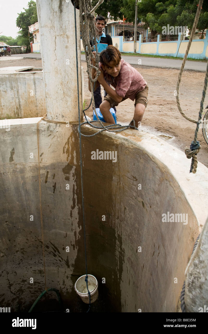 Children Collecting Water From Well Stock Photos & Children Collecting ...
