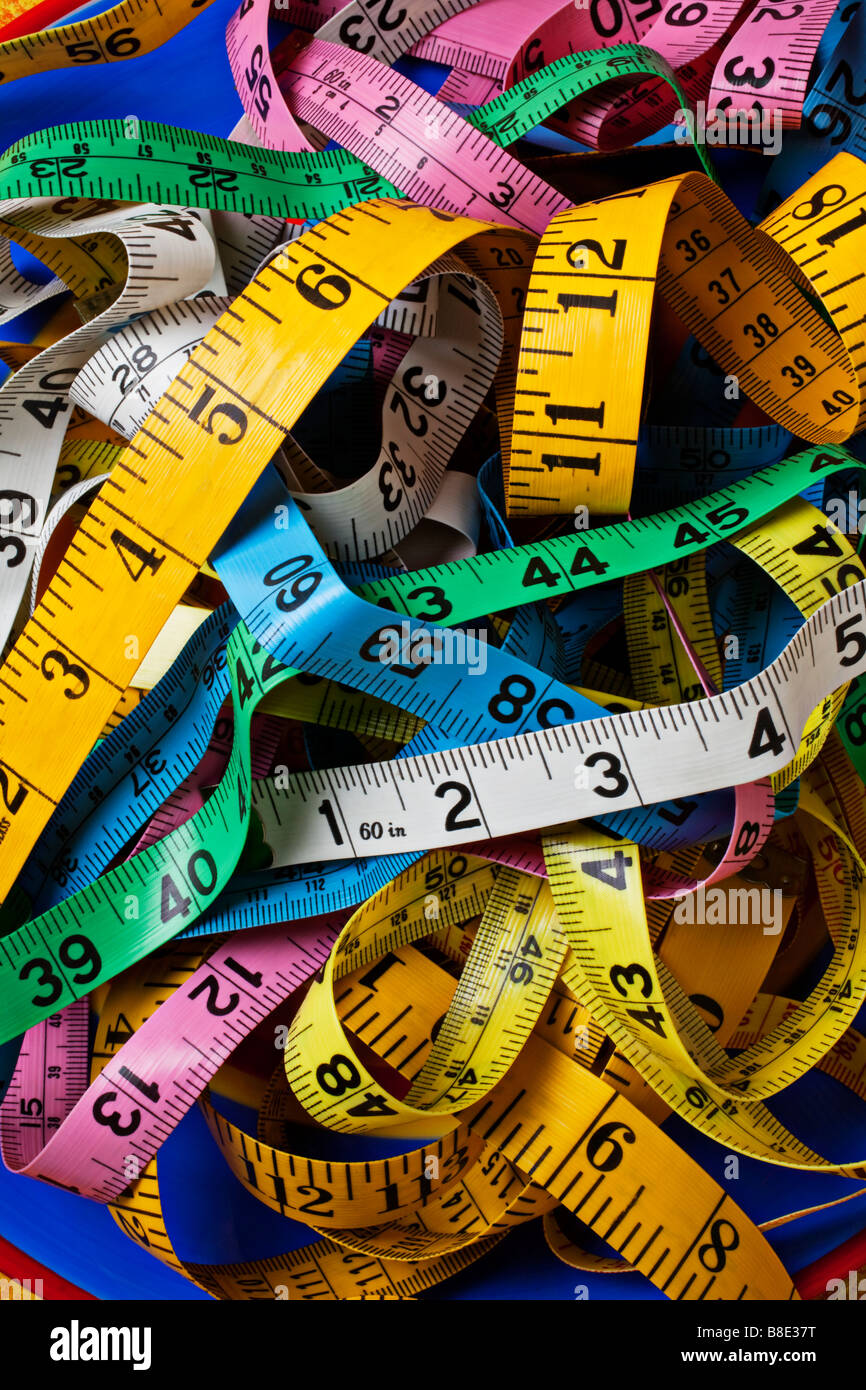 Pile of colorful measuring tapes Stock Photo - Alamy