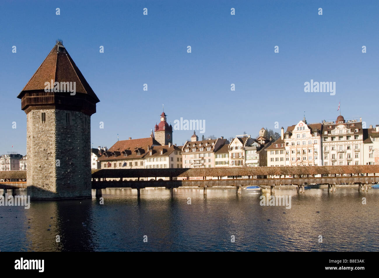Water and Town hall tower and Chapel Bridge or Kapellbrucke wooden ...