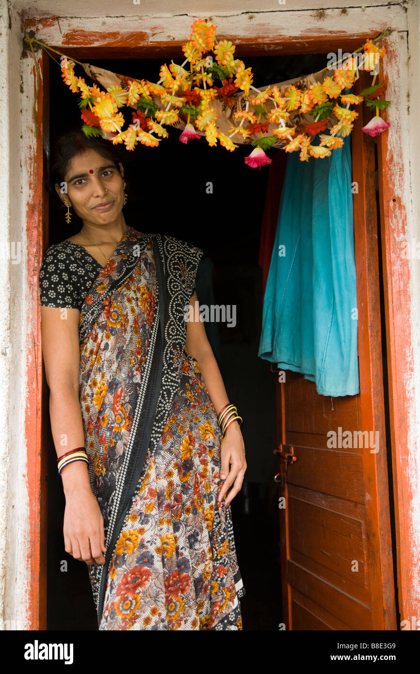 Indian at her front door with toran garlands of flowers – which are a ...