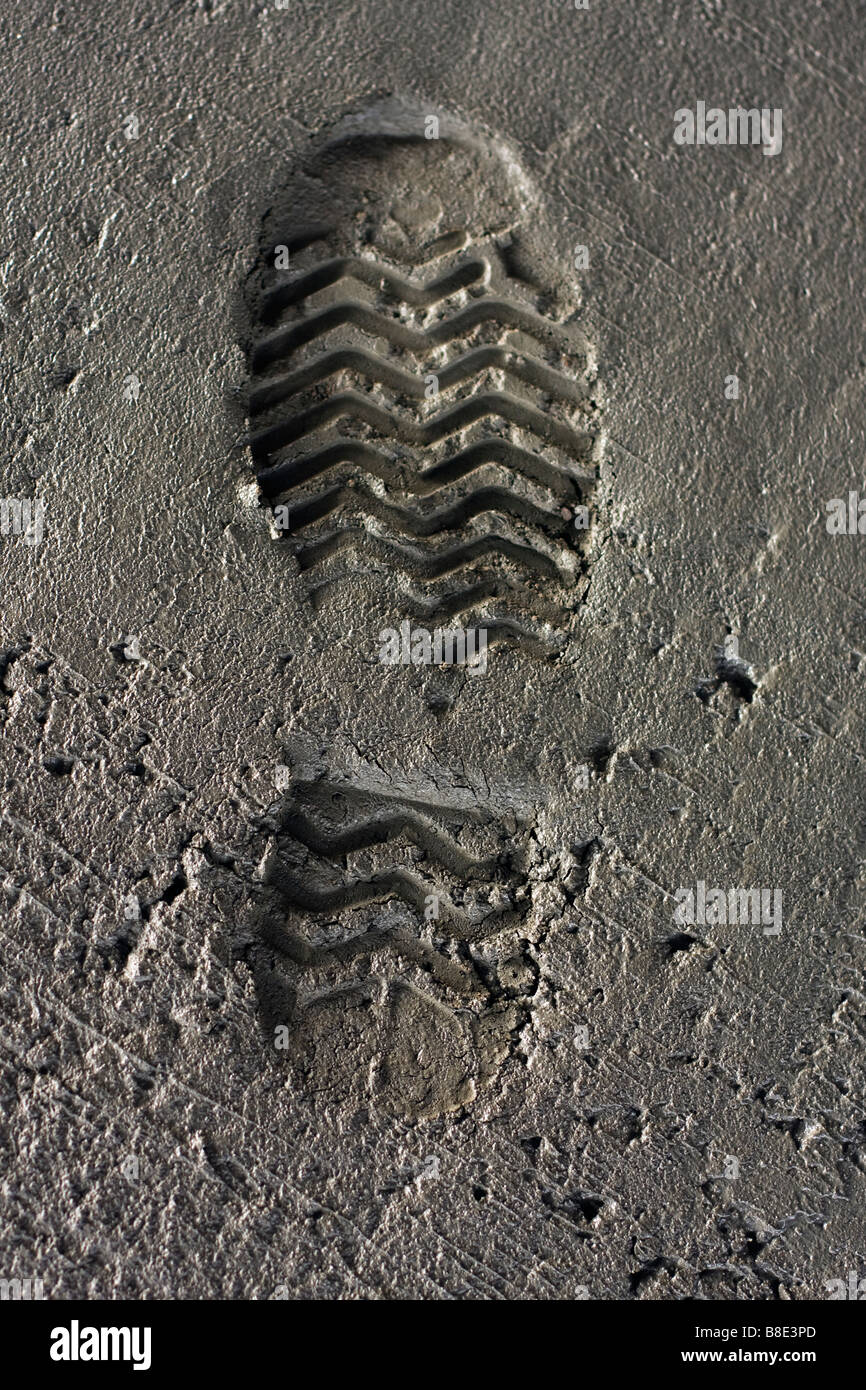 footprint made by a boot on cement Stock Photo - Alamy