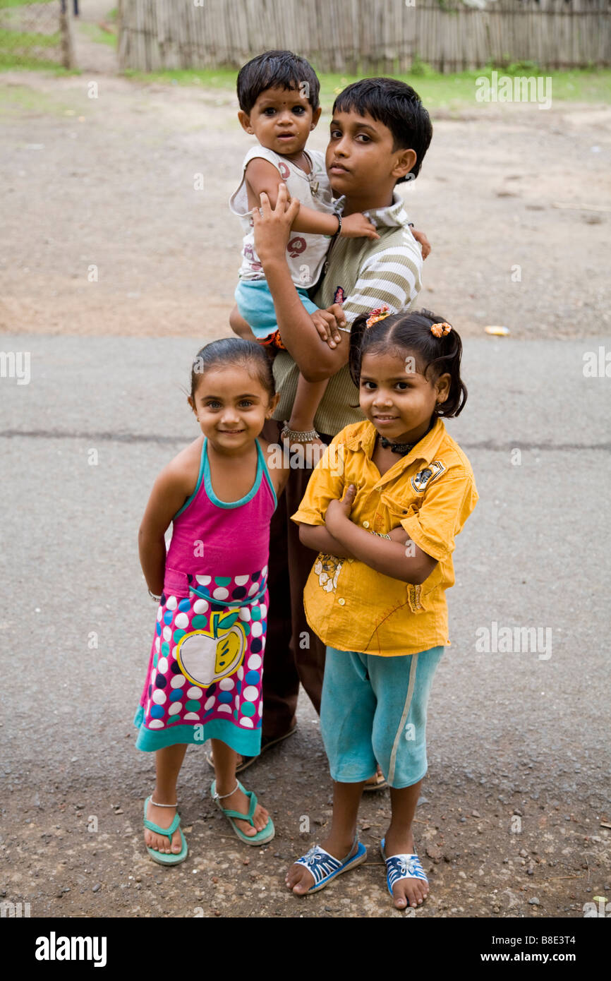 Children pose in the street for a photograph. Hazira, Surat, Gujarat ...
