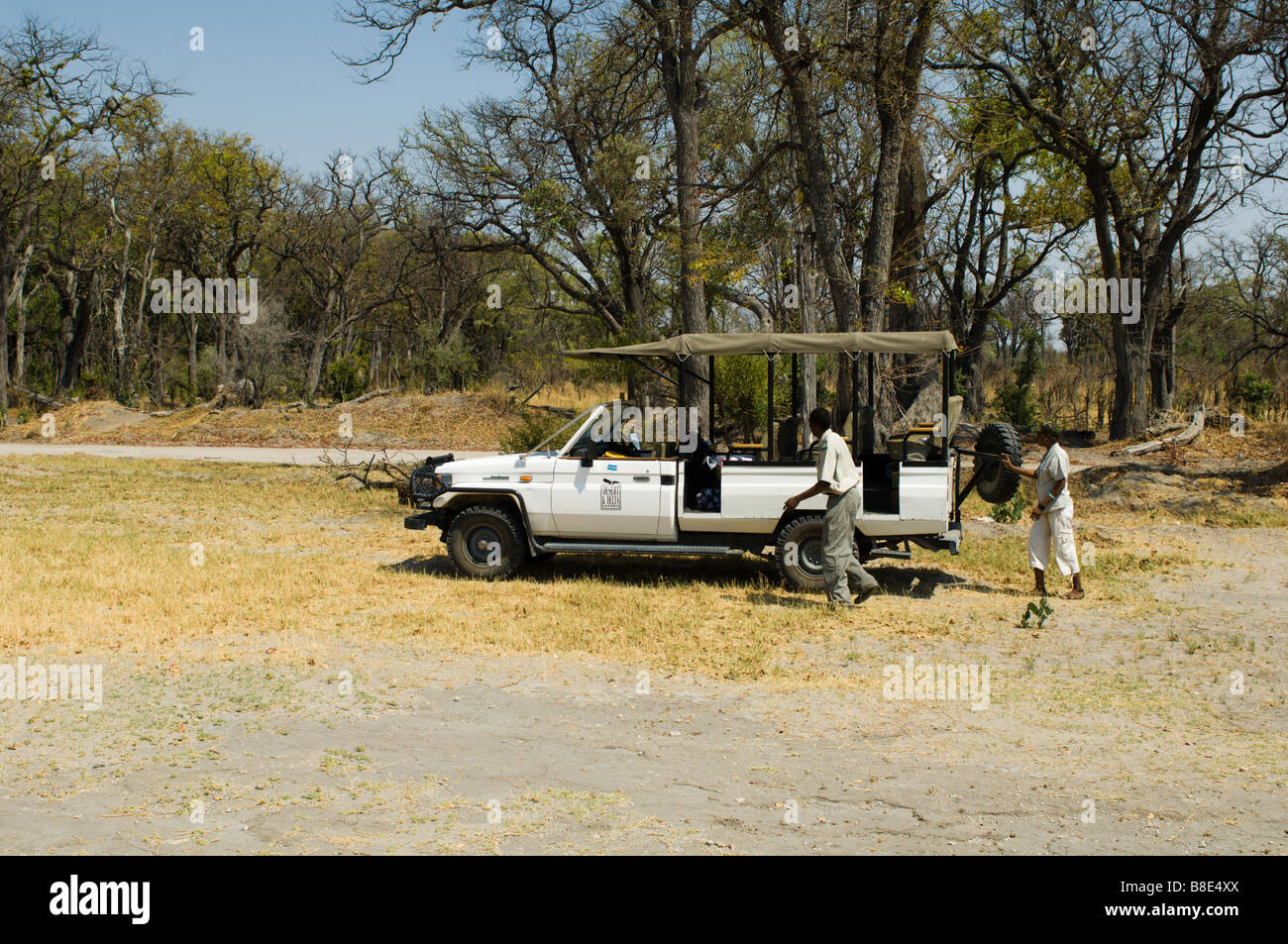 Safari guides in Botswana's Okavango delta Stock Photo - Alamy