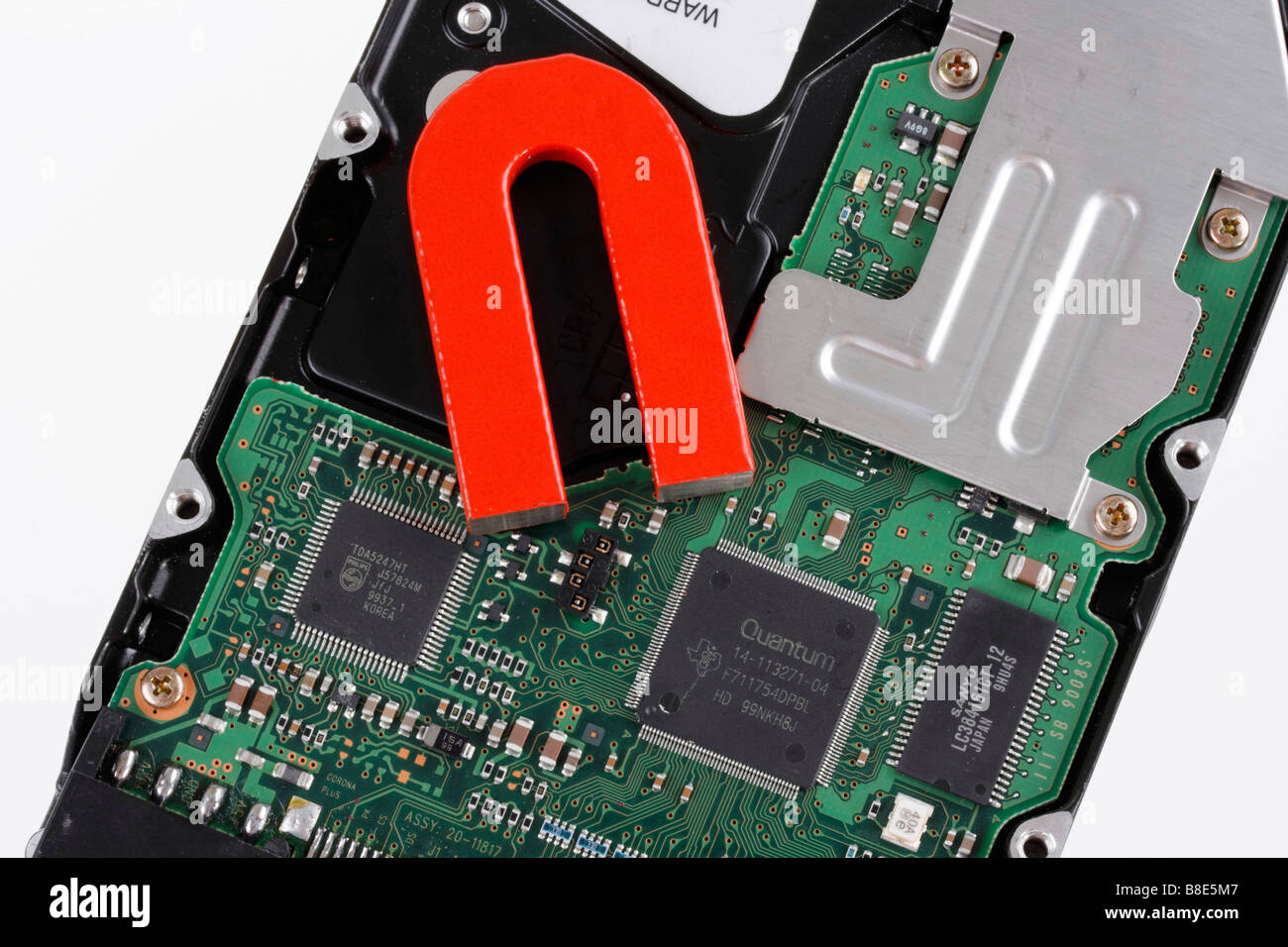 data destruction on computer hard disk by magnet Stock Photo - Alamy