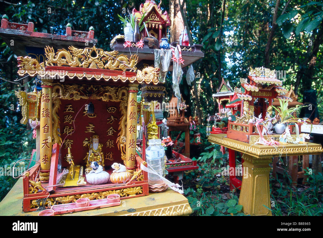 Chinese and Thai spirit houses at a road verge in Thailand Stock Photo ...