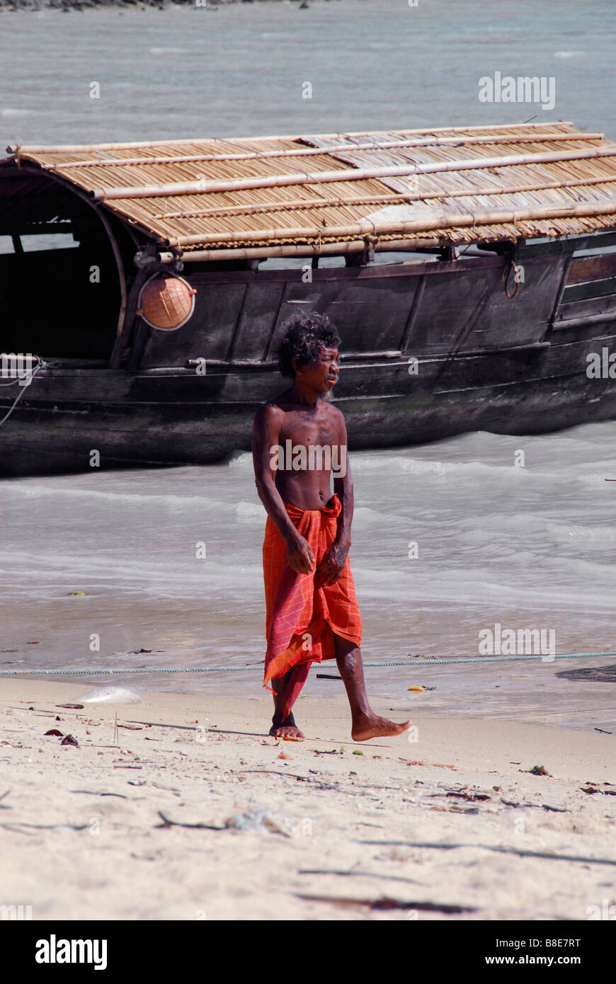 Moken man walking along the beach near his village,Koh Surin,Phangnga ...