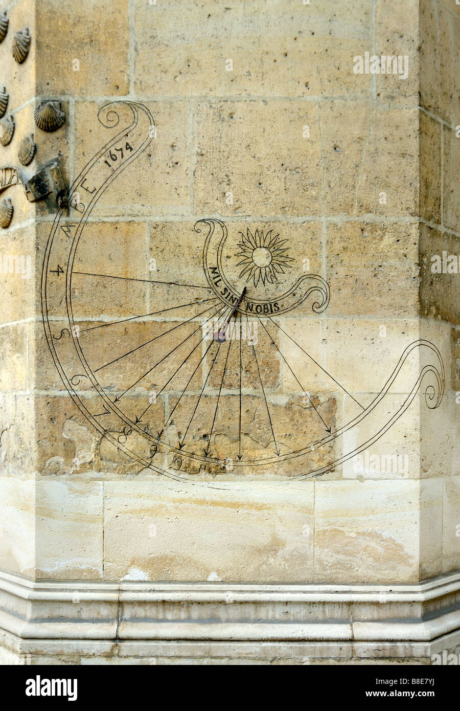 Ancient sundial on a stone wall Stock Photo - Alamy