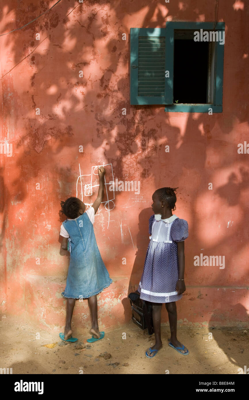 Senegalese Girl Writing on a Wall with Chalk on Ile de Goree in Senegal ...