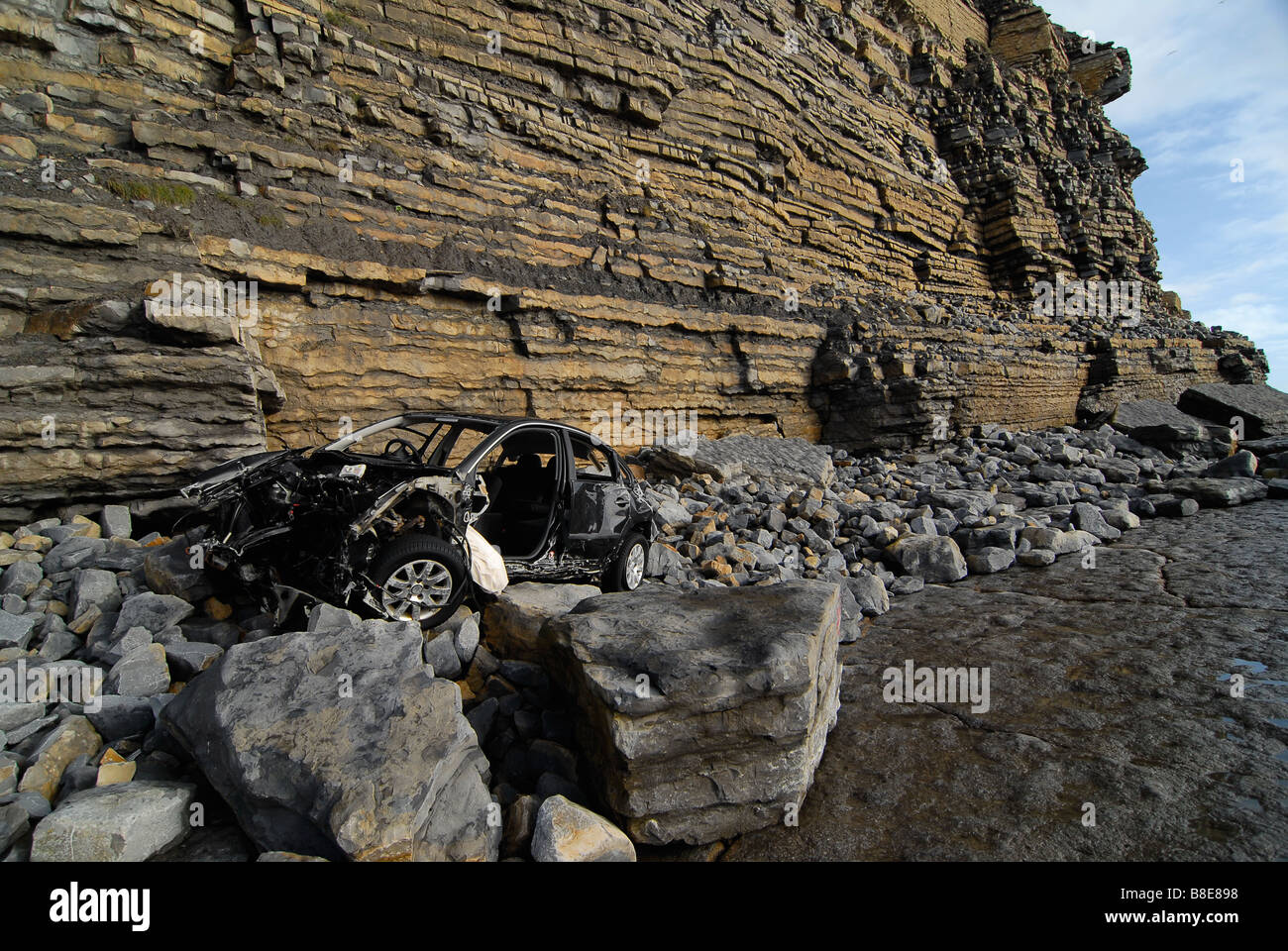 Car at bottom of cliff Stock Photo - Alamy