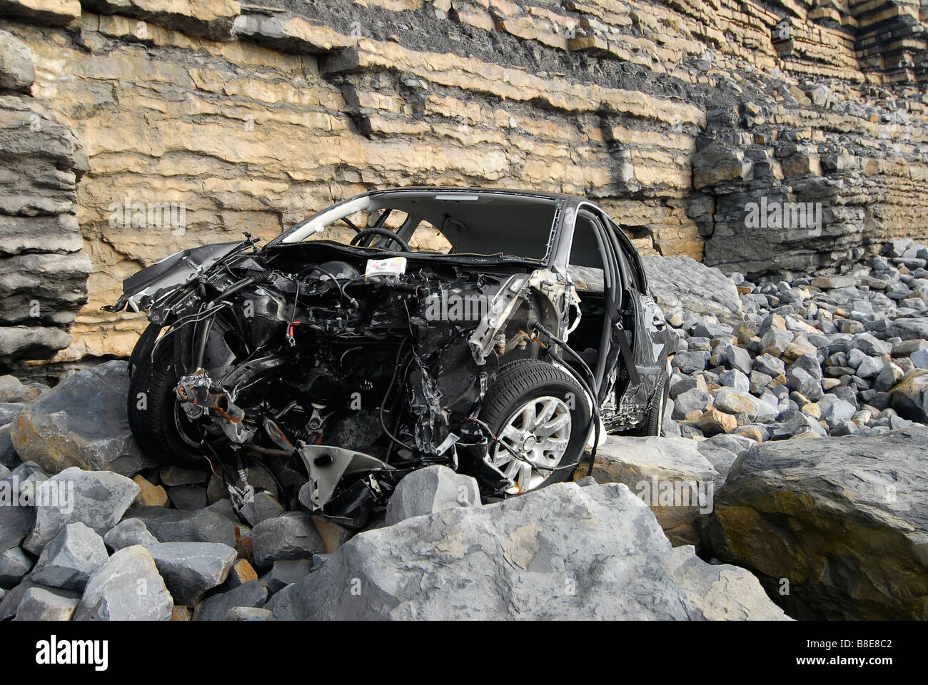 Car at bottom of cliff Stock Photo - Alamy