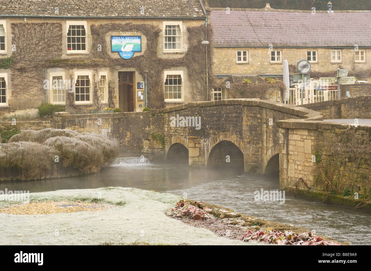 Looking towards to Swan Inn, Bibury over the river Coln Stock Photo - Alamy