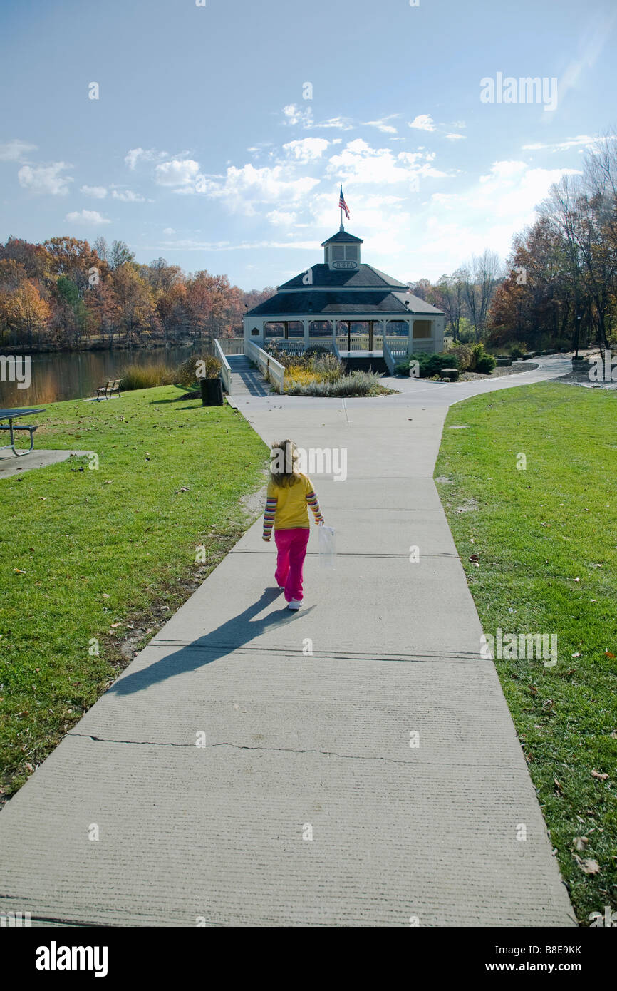 Little Girl Going on a Leaf Walk on a Bright Autumn Day Stock Photo - Alamy