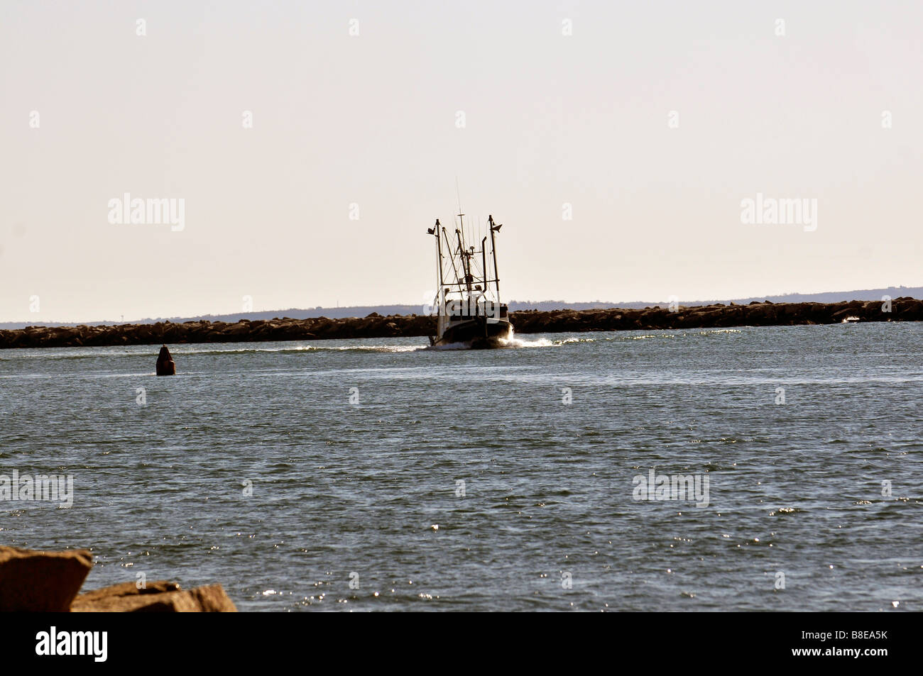 Commercial fishing boat returning to port in Galilee rhode island Stock ...