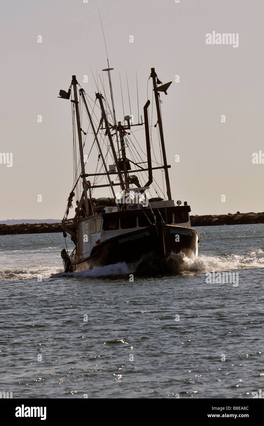 Commercial fishing boat returning to port in Galilee rhode island Stock ...