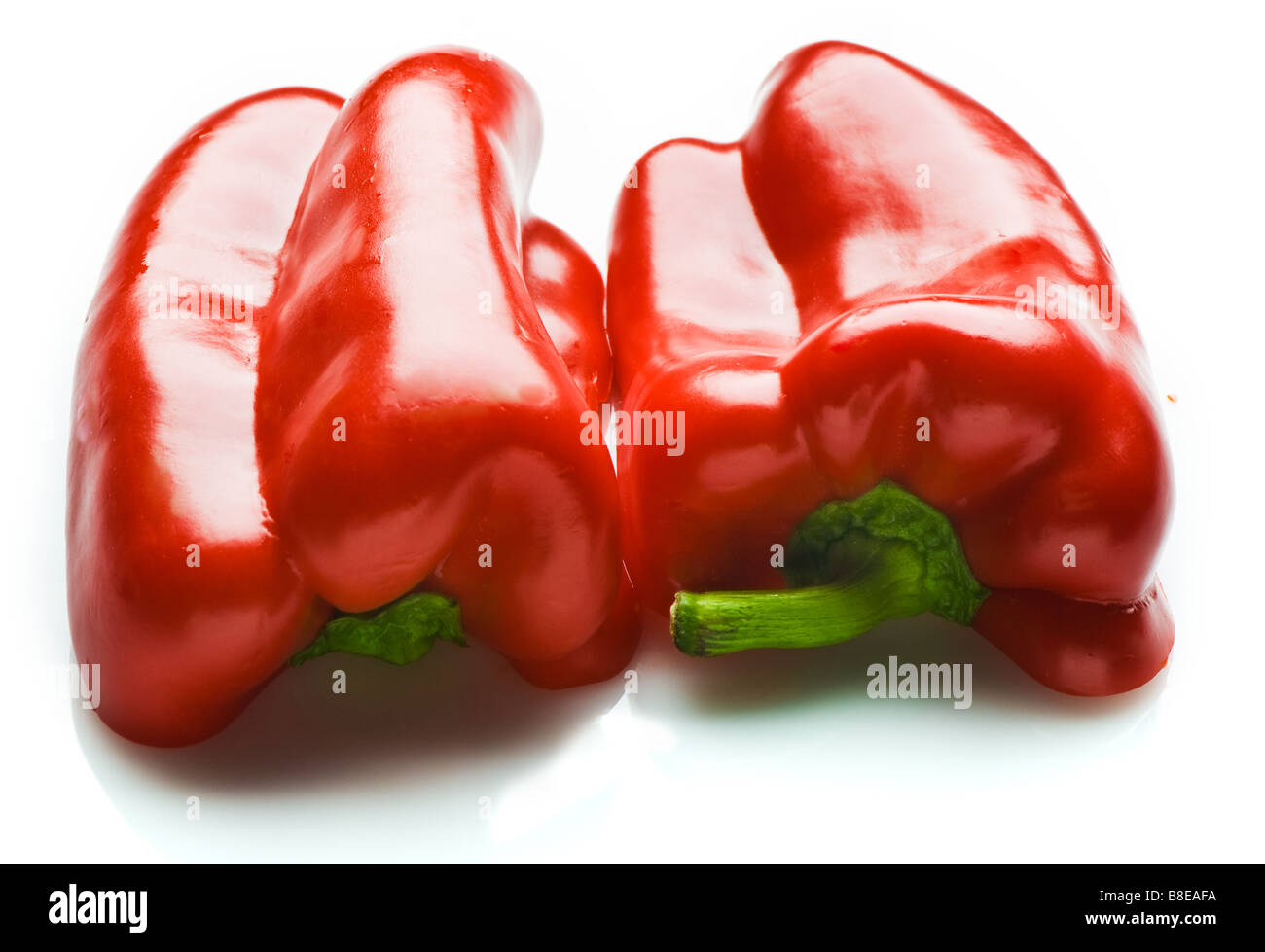 A red capsicum cut in half Isolated on white Stock Photo - Alamy