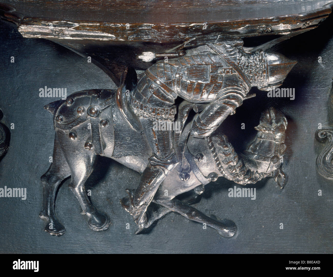 Lincoln Cathedral Misericord knight shot by arrow Stock Photo - Alamy