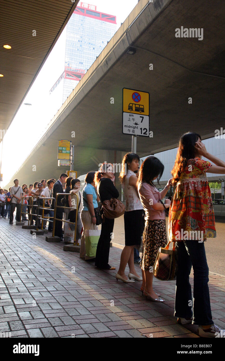 An orderly queue / line waiting for a bus in Hong Kong, China Stock ...