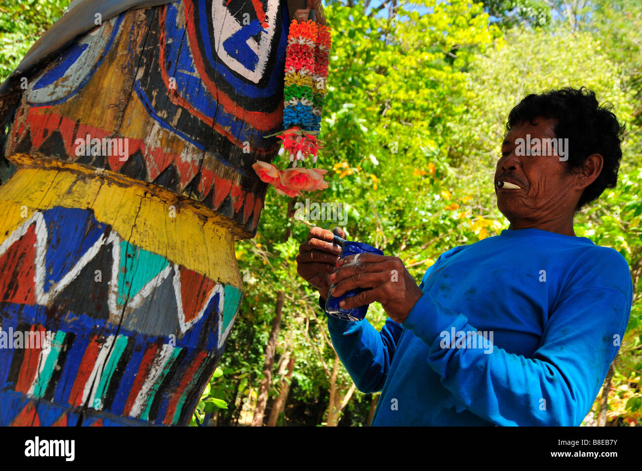 Moken man is painting Lowbor(moken's god) before anniverasy merit ...