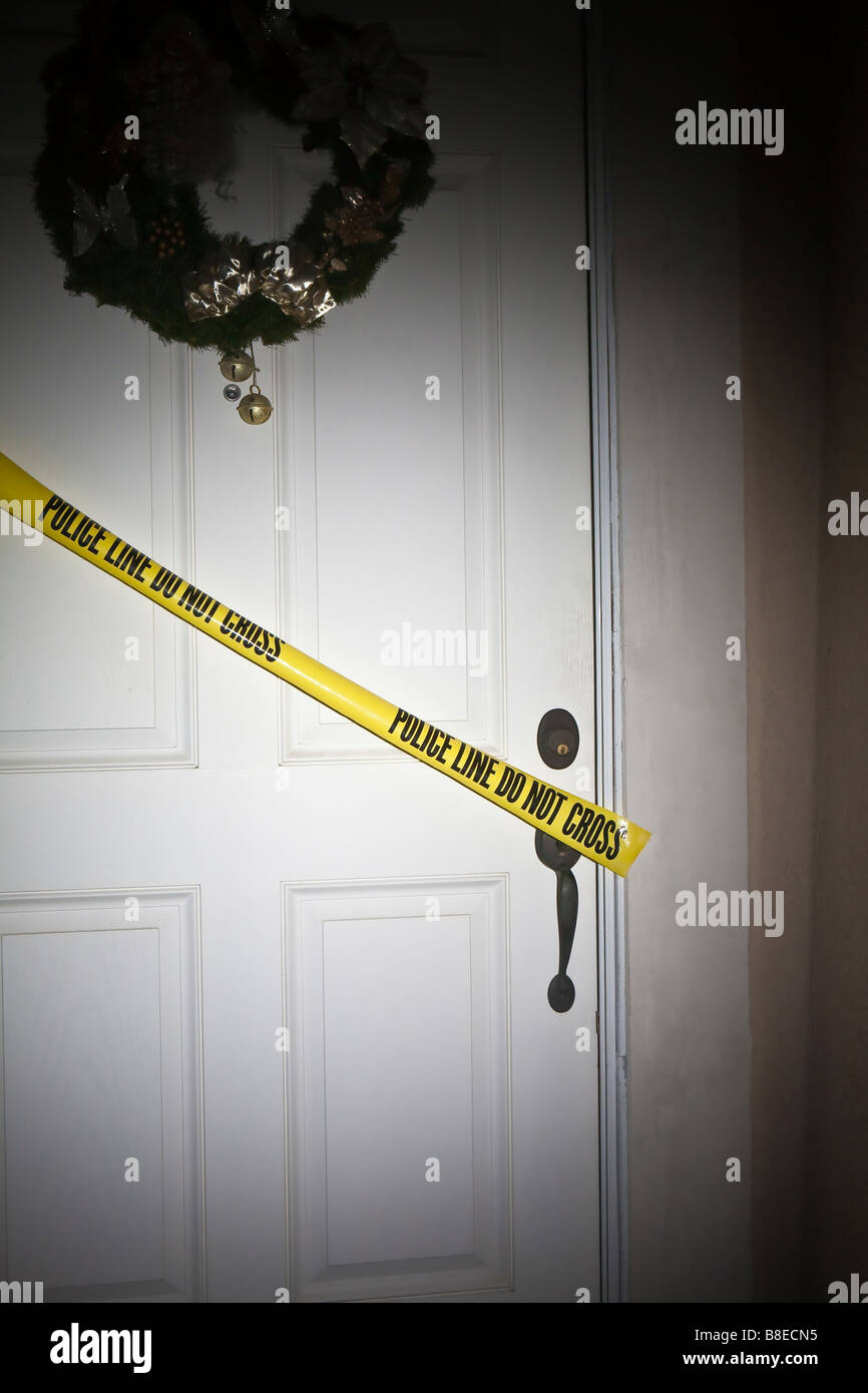 Police line tape across white front door of home at night Stock Photo ...