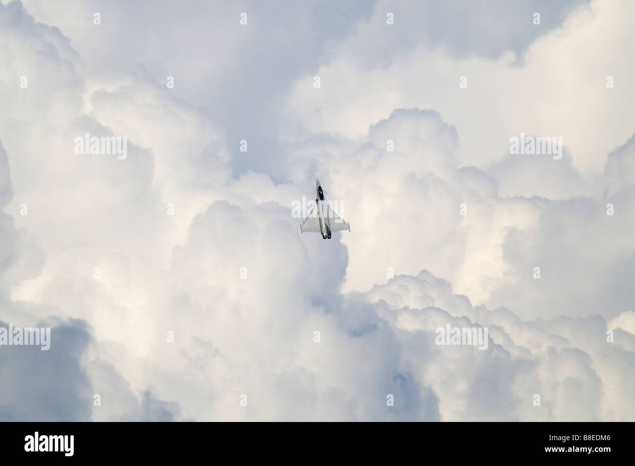 Eurofighter Typhoon climbs vertically during an airshow display against ...