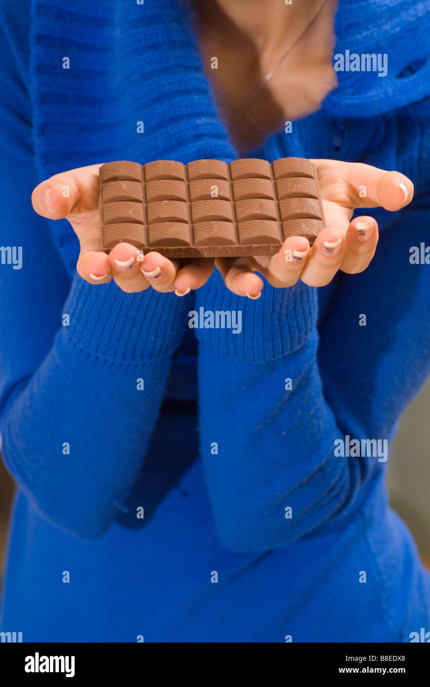 Human hands holding chocolate bar hi-res stock photography and images ...