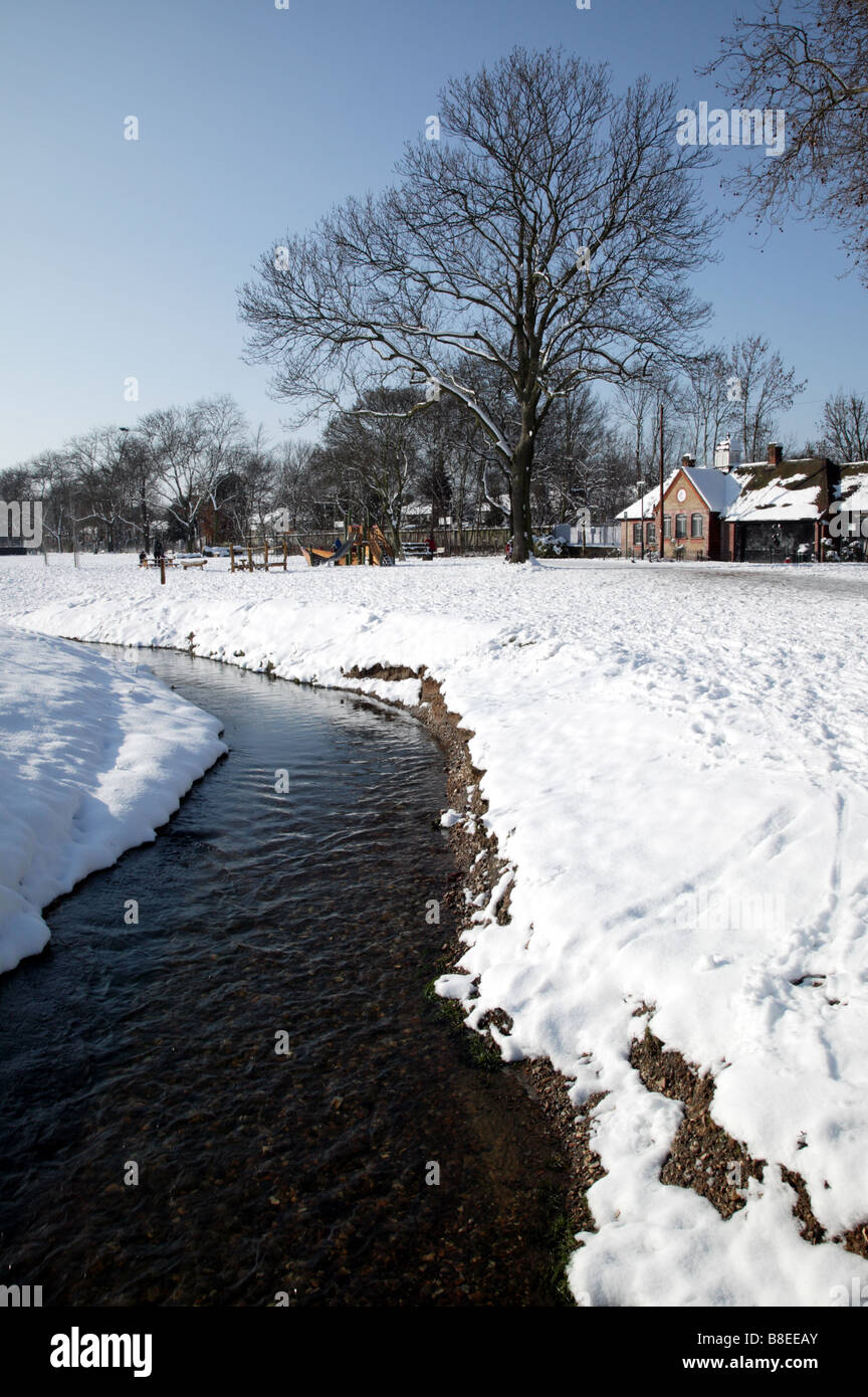 Snowscape showing the River Ravensbourne running in a secondary channel ...