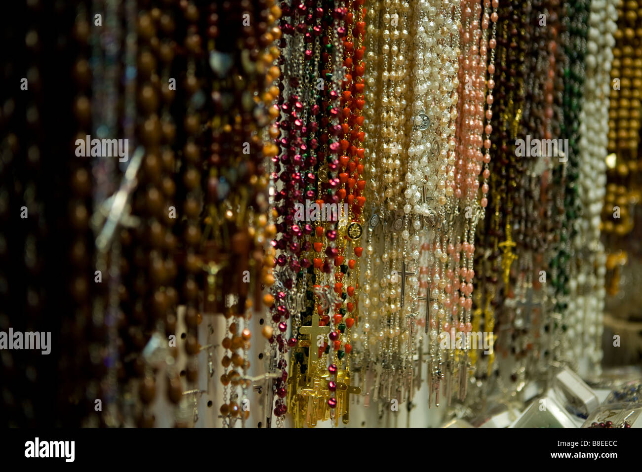 Rosaries for sale in a church cathedral in Rome Italy Stock Photo - Alamy