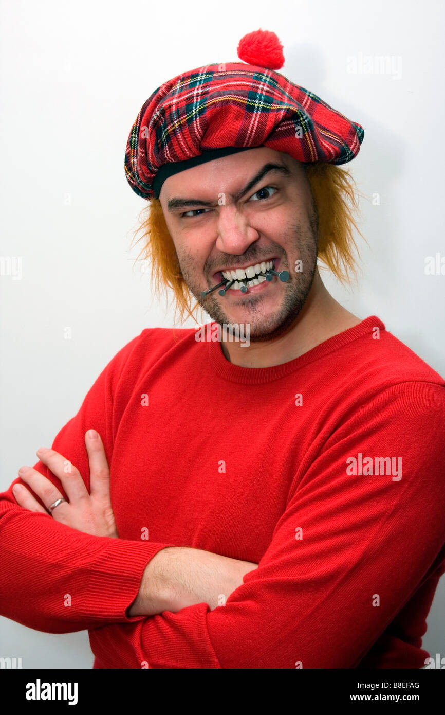 Angry Scotsman chewing nails Stock Photo - Alamy